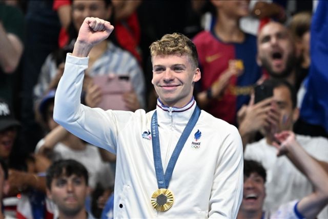 French swimmer Marchand wins gold medal with Olympic record - Timeturk ...
